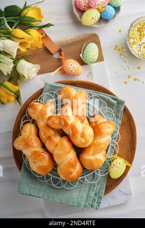 Easter breakfast rolls with orange glaze shaped like an easter bunny ...