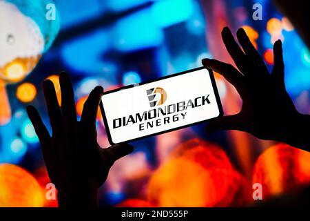 In this photo illustration, the Diamondback Energy company logo is seen ...