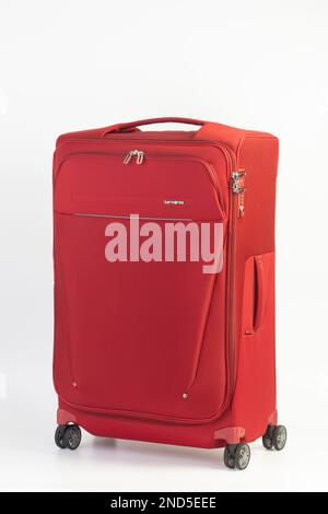A red, lightweight Samsonite suitcase Stock Photo - Alamy