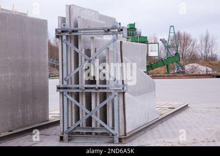 Picture of precast concrete walls ready for shipping in transport racks ...
