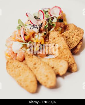 Whole grilled avocado with salmon and sauce Stock Photo - Alamy
