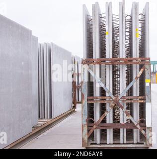 Picture of precast concrete walls ready for shipping in transport racks ...