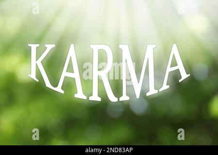 Word KARMA on blurred green background, bokeh effect Stock Photo - Alamy