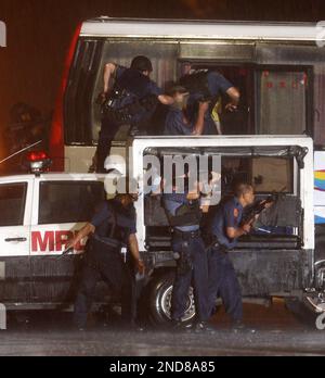 Police and SWAT members assault a tourist bus to rescue hostages at ...