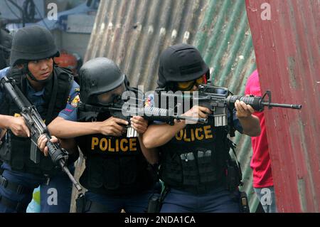 Philippine National Police SWAT members and other police investigators ...