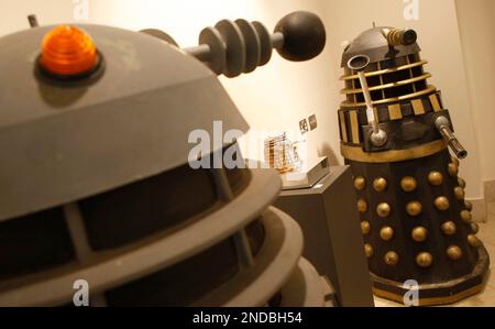 Two Daleks from the BBC TV series. A Red Mark Three Dalek next to a new ...