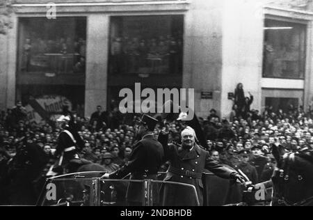 Winston Churchill waving to the crowds in WHitehall in London at the ...