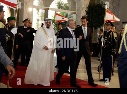 Lebanese President Michel Suleiman, center, arrives to attend a ...