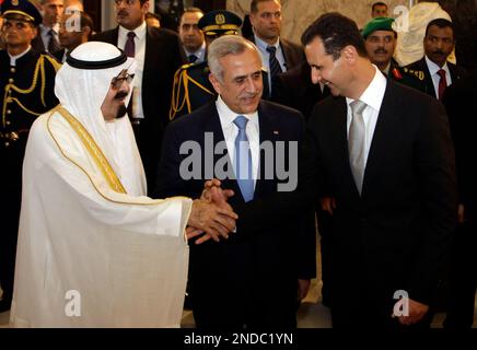 Lebanese President Michel Suleiman, center, arrives to attend a ...