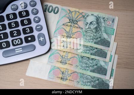 Czech Republic 100 kroner paper banknote and a calculator. King Karel ...