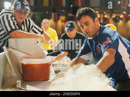 Judge Lori Starr watches as Pali Grewal competes in the Domino's ...