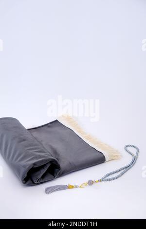 praying mat top view white background. Islamic shop items Stock Photo ...
