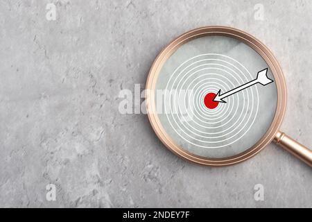 Magnifying glass with goals. The aim of success Stock Photo - Alamy