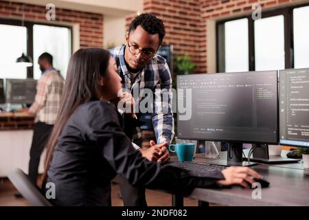 Team of Young IT Programers Working on Desktop Computers in Data Center ...