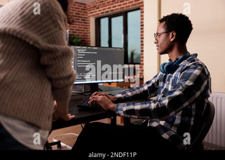 Team of Young IT Programers Working on Desktop Computers in Data Center ...