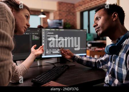 System engineers using binary code to script security system, working ...