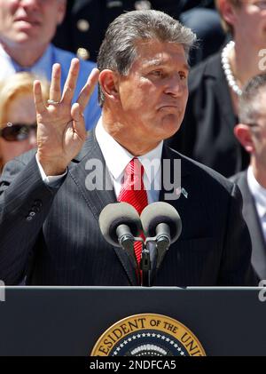 Gov. Joe Manchin speaks during a press conference as Amy King, left, of ...