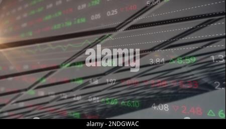 Composition of stock market over window and light trails Stock Photo ...