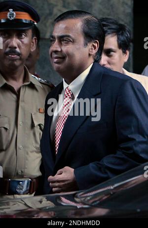 Chairman of Reliance Industries Limited Mukesh Ambani, left, speaks with Chief Executive Officer ...