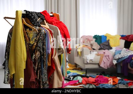Mess of clothes all over room. Fast fashion Stock Photo - Alamy