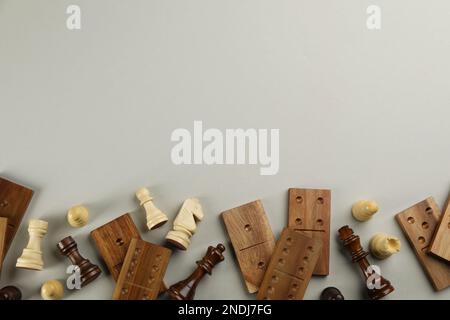 Chess board with chess pieces on grey background Stock Photo - Alamy