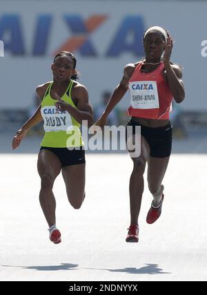 Jamaica's Sheri-Ann Brooks, right, celebrates after winning the gold ...