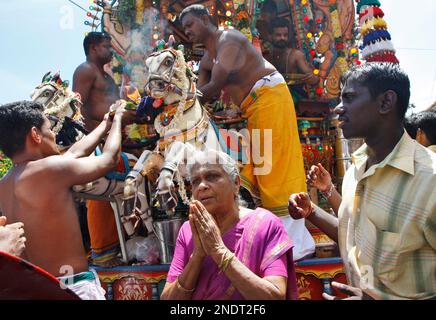 Sri Lankan Hindu devotees participate in a Paal Kudam, a ritual where ...