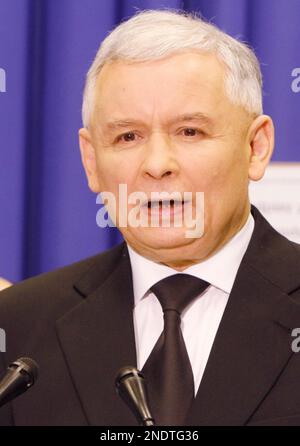 Supporters of the late president Lech Kaczynski carry his portrait as ...