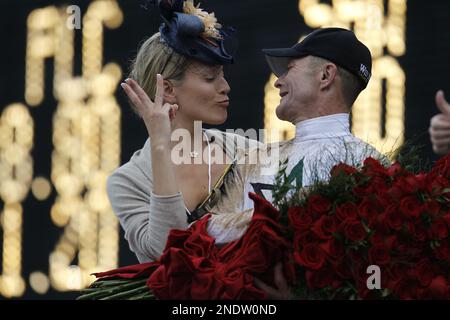 Calvin Borel kisses his wife, Lisa, after Borel rode Super Saver to ...