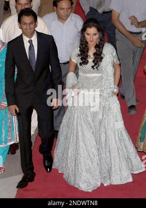 Pakistani cricketer Shoaib Malik, with his wife Indian tennis star ...