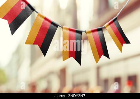 Small flags of the Germany on an abstract blurry background Stock Photo ...
