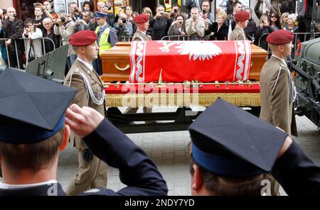 People salute in front of the coffin of late Polish President Lech ...