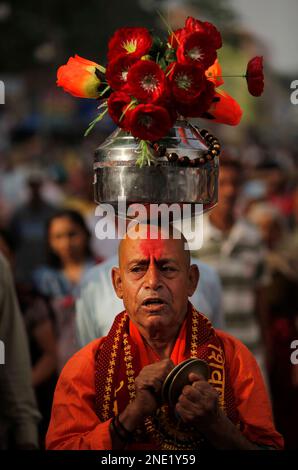 Indian man singing devotional songs waiting to be seen at Sri Sathya ...