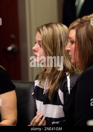 Elizabeth Johnson, left, mother of missing baby Gabriel, sits next to ...