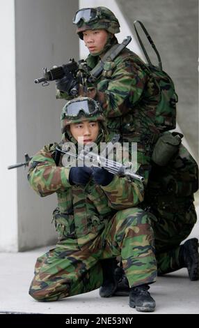 U.S. Marines participating in the Annual Rifle Qualification use ...