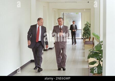 Officer Ted Briseno, left, and his attorney John Barnett talk during a ...