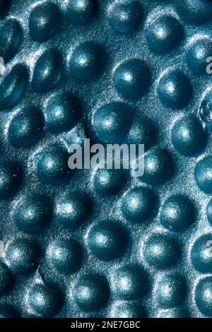 A Alien trypophobia holes in a shiny sci-fi close up background Stock ...