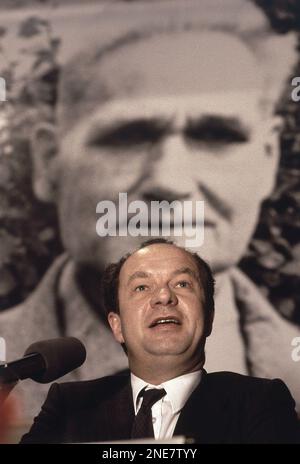 Dwarfed by a huge photograph of his father Rudolf Hess, Wolf Ruediger ...