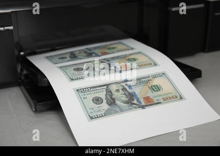 Printing dollar banknotes on grey table. Fake money concept Stock Photo ...