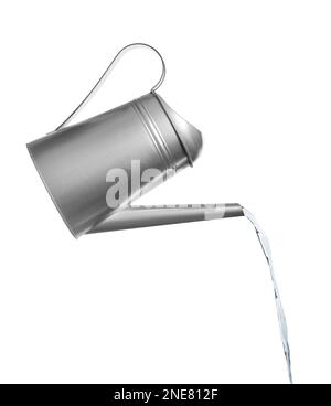 Pouring liquid from watering can on white background Stock Photo - Alamy