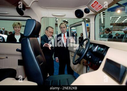 Gov. John Engler and wife Michelle pose with their triplets during a ...