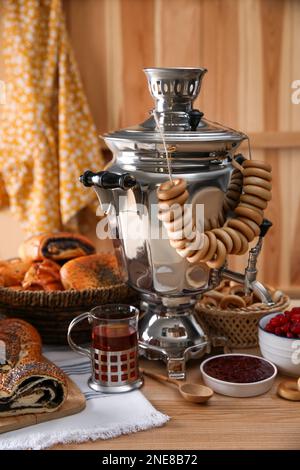 Traditional Russian samovar and treats on white background Stock Photo ...