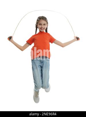 Sporty tween girl jumping rope in school yard during recess Stock Photo ...