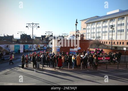 Nurses strike on picket line with protest placards stand in the cold ...