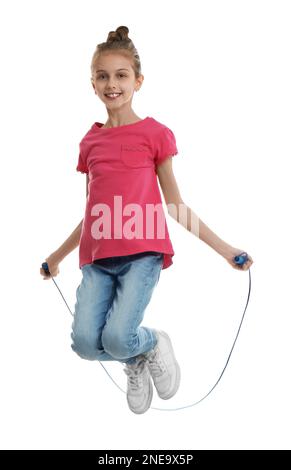 Sporty tween girl jumping rope in school yard during recess Stock Photo ...