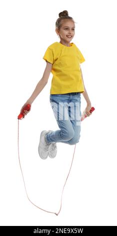 Sporty tween girl jumping rope in school yard during recess Stock Photo ...