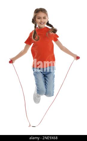 Sporty tween girl jumping rope in school yard during recess Stock Photo ...