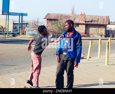 Lindsay Tshabalala, right, a Zulu beaten and burned to death as a ...