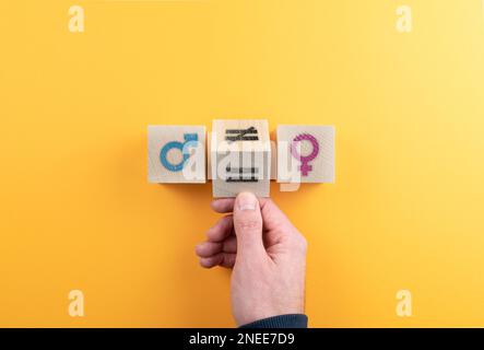 Gender equality concept. Wooden block turning a unequal sign to a equal ...