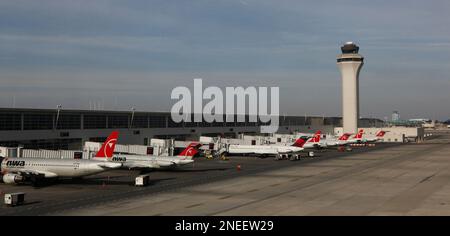 Delta and Northwest Airlines aircraft are shown at the McNamara ...